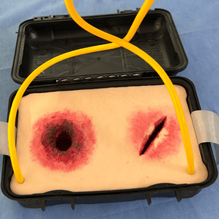 Double wound simulator for wound packaging with transport box Stop The ...